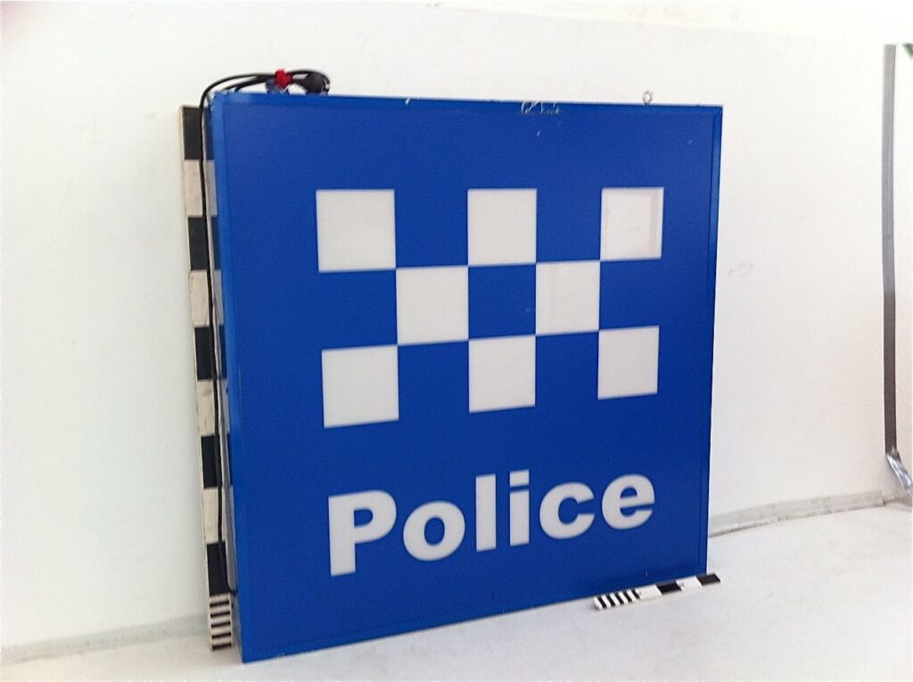 Lit police sign – PropCo